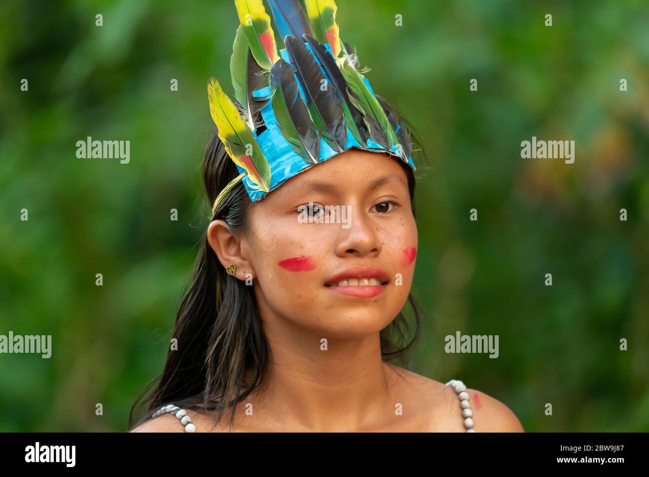 Peruvian girl dressed in traditional celebratory garb meets visitors ...