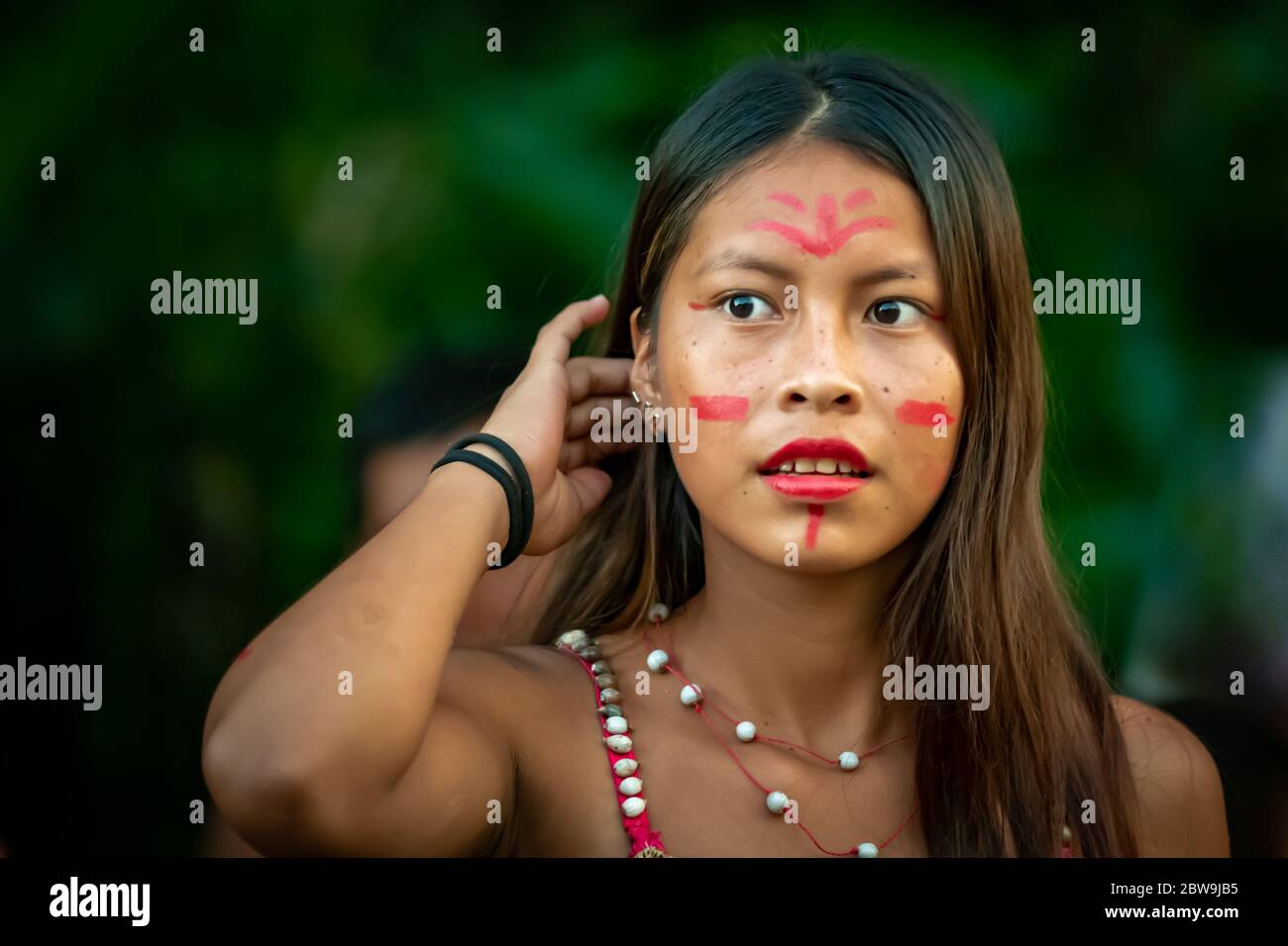 Peruvian girl dressed in traditional celebratory garb meets visitors ...