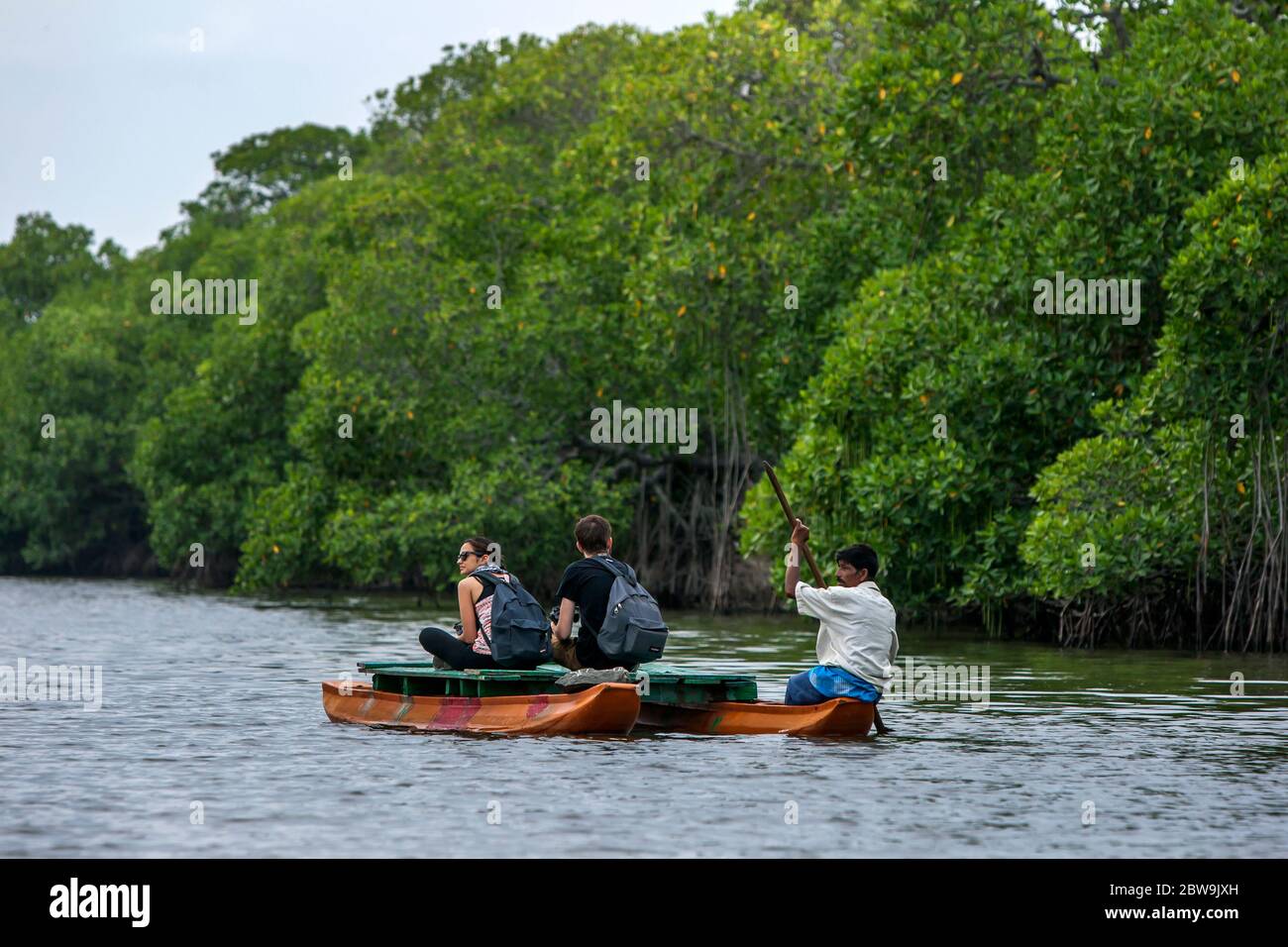Foreign tourists are taken on a tour of Pottuvil Lagoon at Pottuvil in ...
