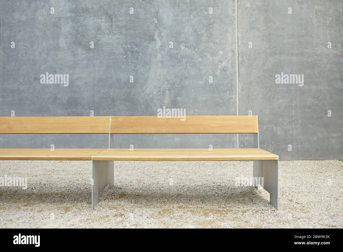 Wooden modern bench againstÂ concrete wall Stock Photo - Alamy