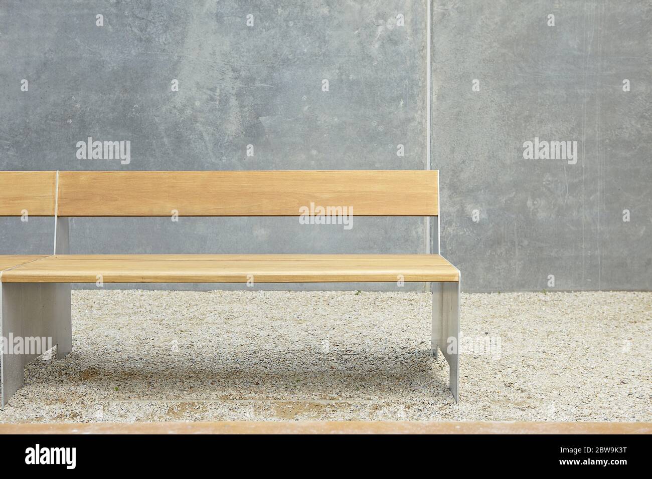 Wooden modern bench againstÂ concrete wall Stock Photo - Alamy