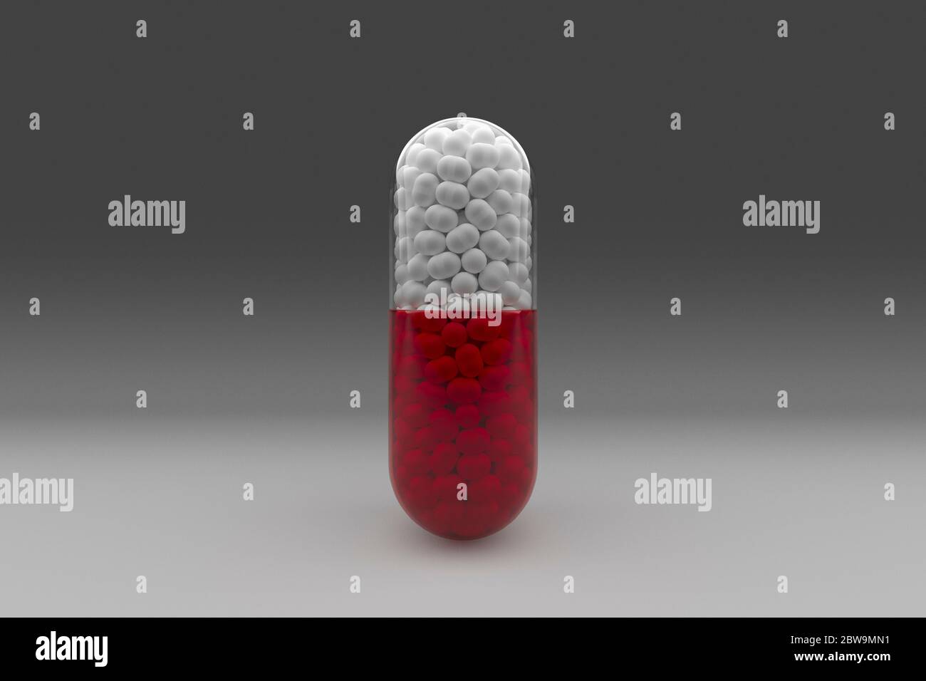 Studio shot of red and white capsule Stock Photo - Alamy