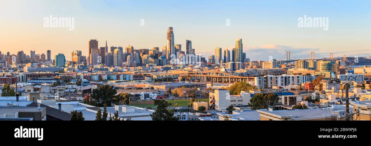 San Francisco city skyline panorama just before sunset with city lights ...