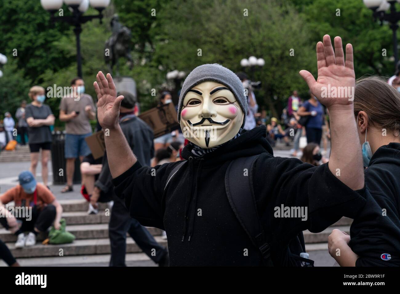 New York, NY - May 30, 2020: A man wearing anonymous mask attends ...