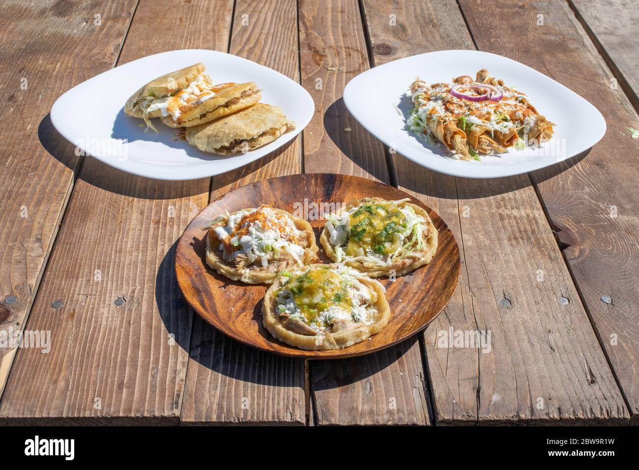 variety of Mexican food dishes. sopes, tacos, gorditas stuffed Stock ...