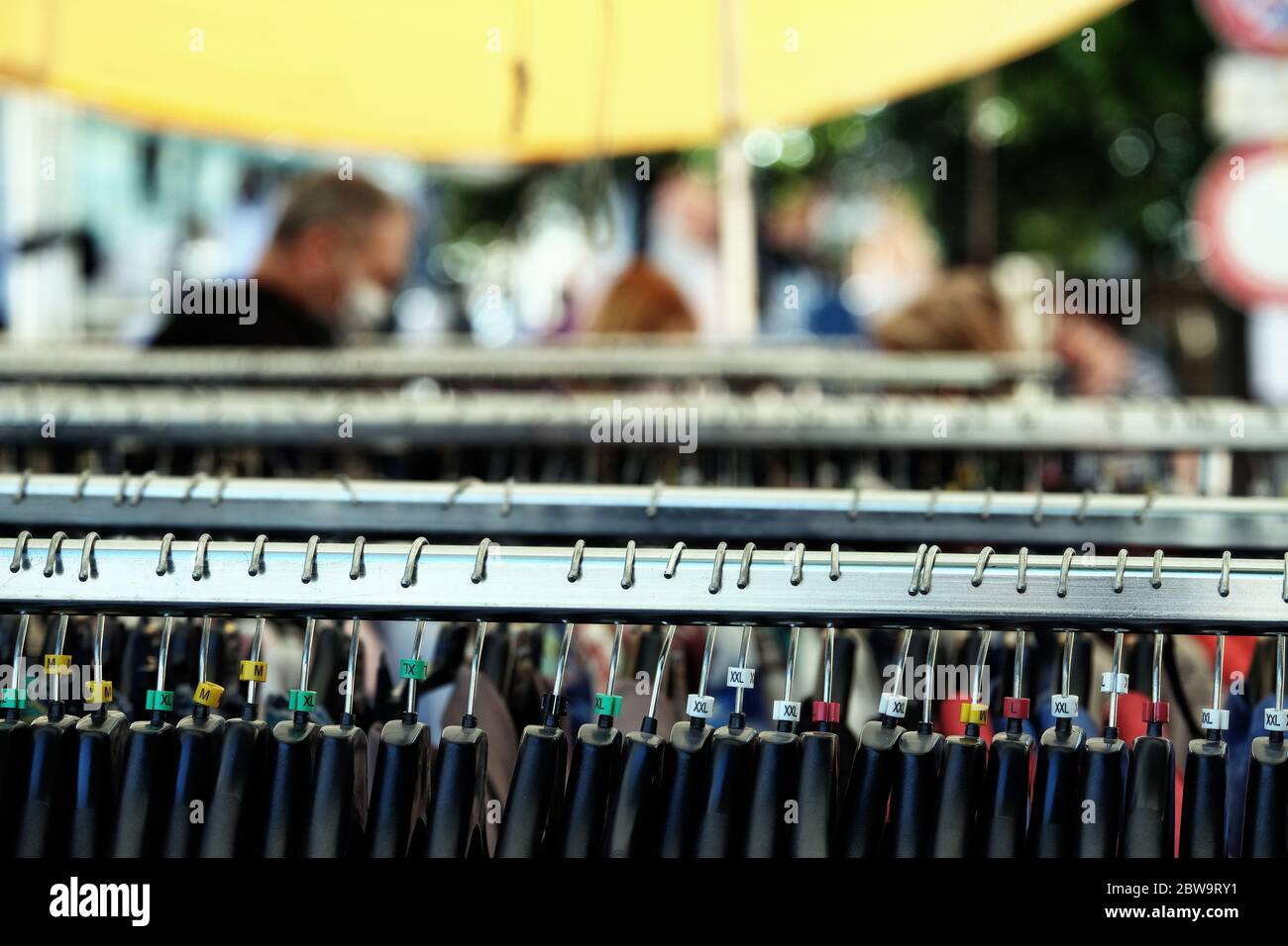clothes hangers in a market stall Stock Photo - Alamy