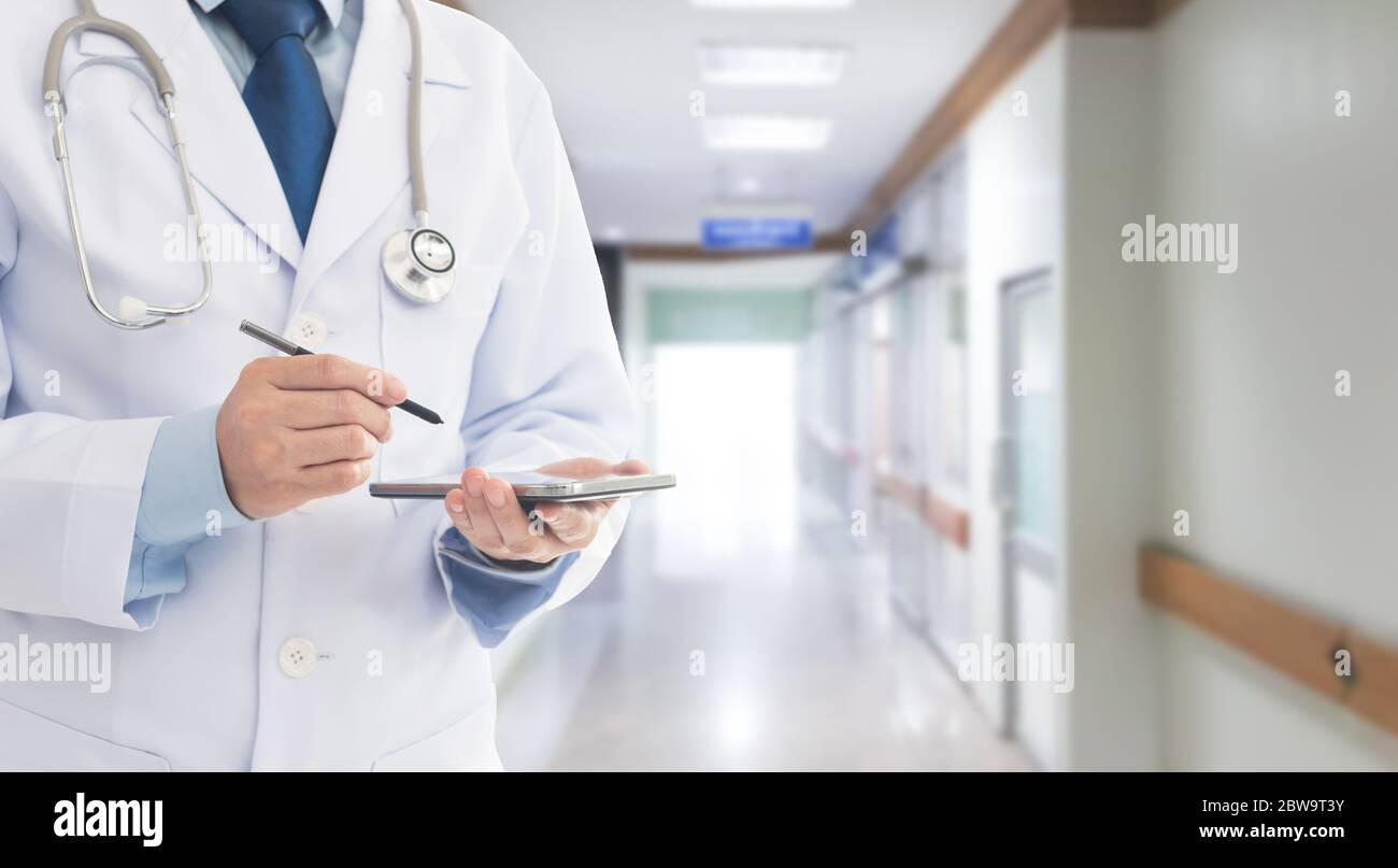 Doctor using a smart phone in hospital. Concept of healthcare and ...
