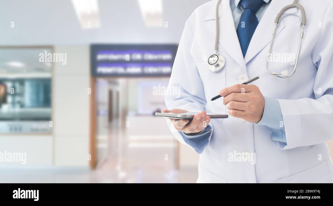 Doctor using a smart phone in hospital. Concept of healthcare and ...