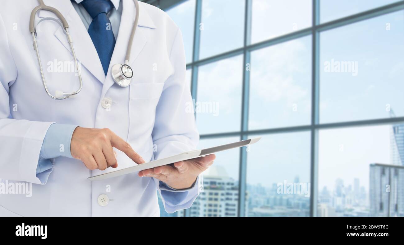 Doctor using a digital tablet in hospital. Concepts of doctor, medical ...