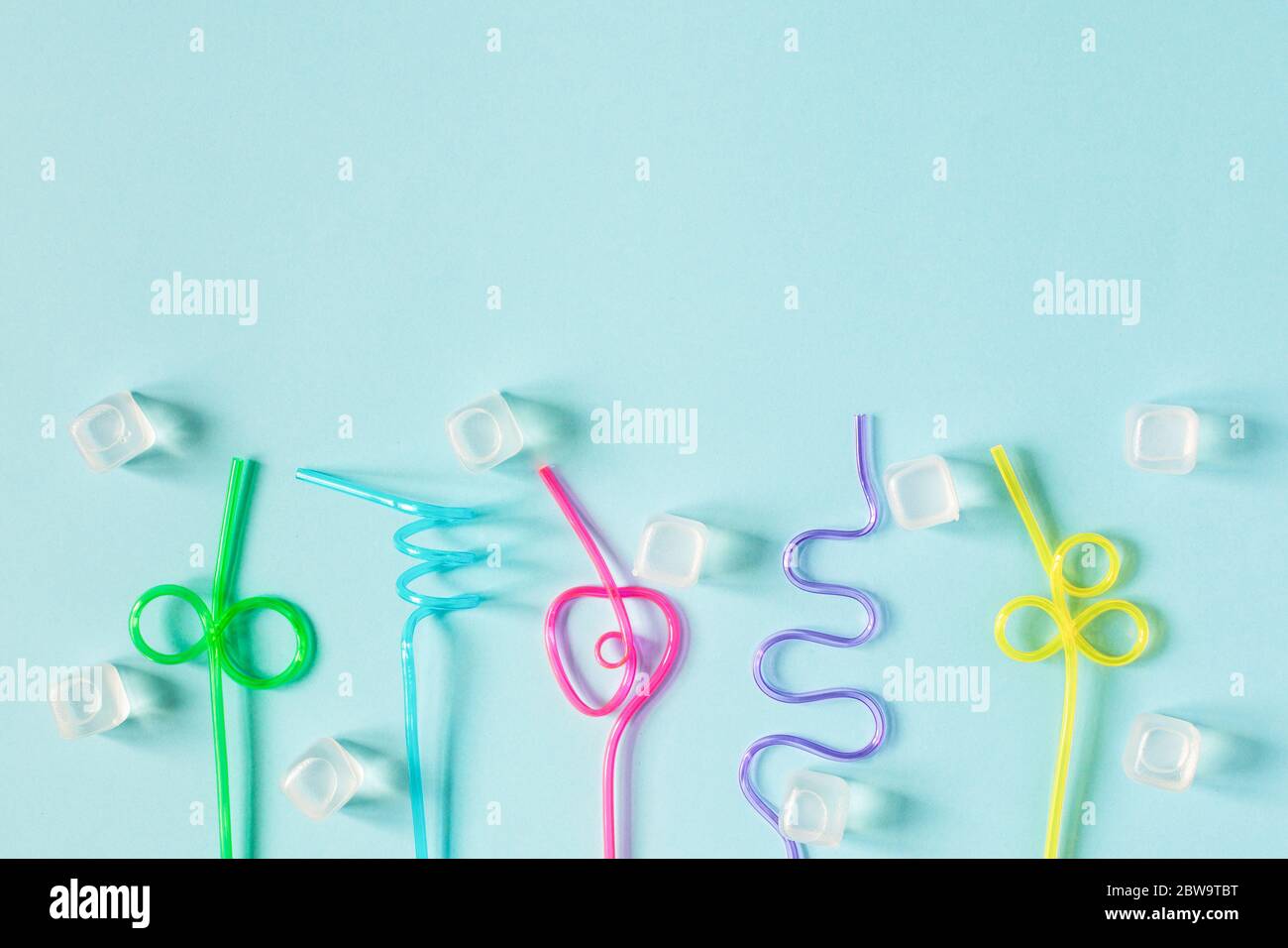 Creative summer background composition with colorful cocktail straws ...