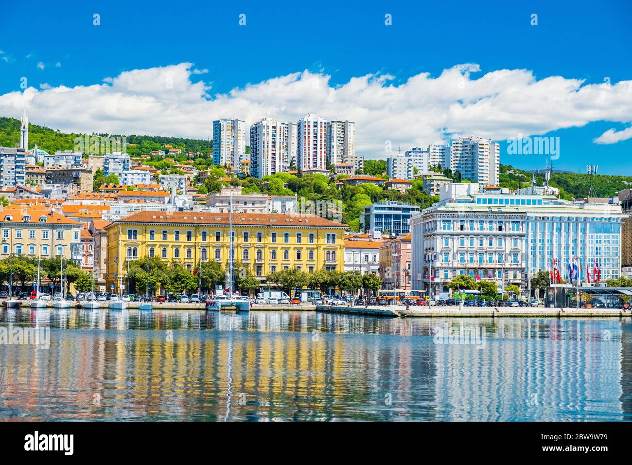 Waterfront view of the city of Rijeka, Croatia. Boats in marina and old ...