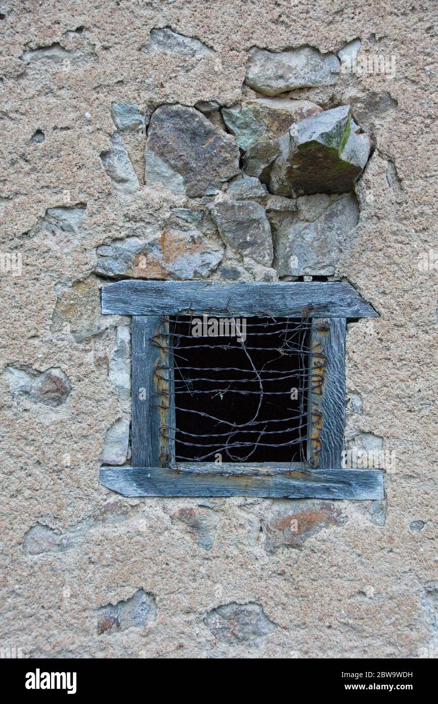 Window covered with barbed wire Stock Photo - Alamy