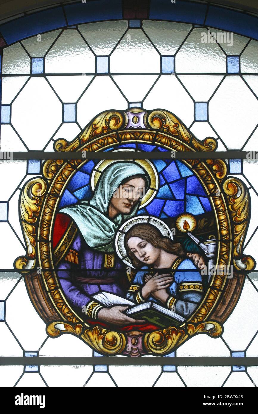 St. Anne, stained glass window in the church of the Holy Family in ...