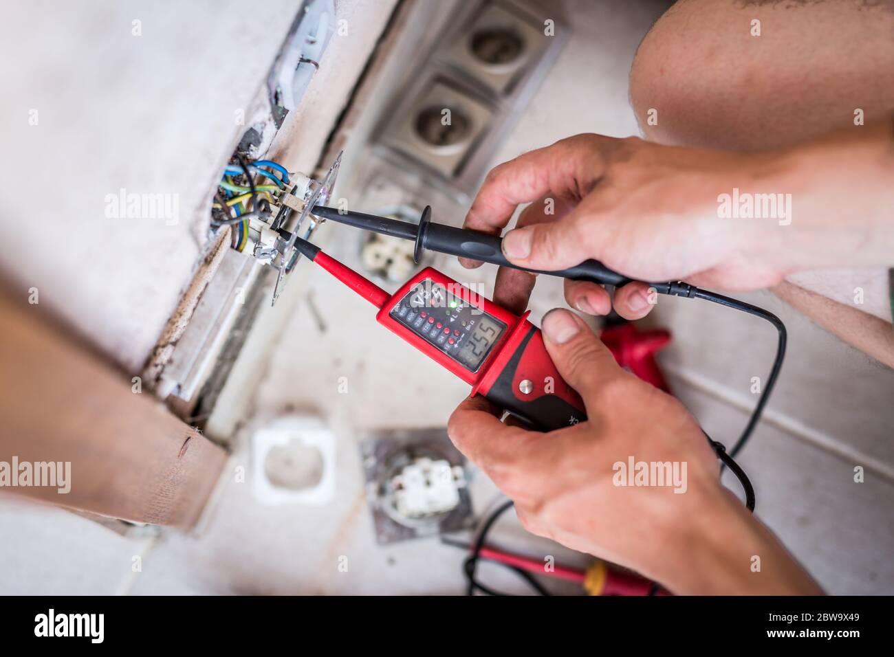 Closeup of electrician hands fixing a socket Stock Photo - Alamy