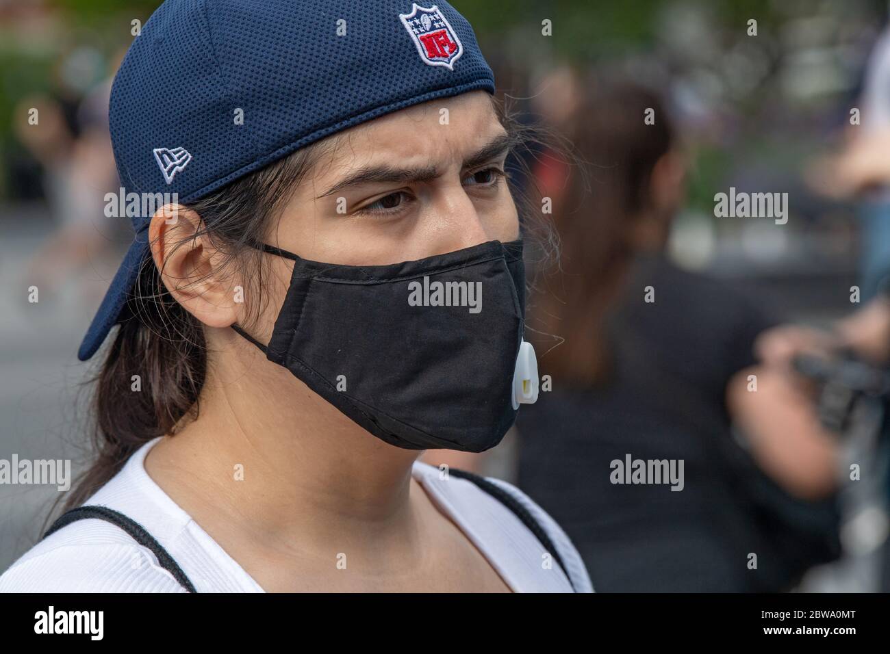 NEW YORK, NY - MAY 30, 2020: A protester wearing facial masks seen on ...