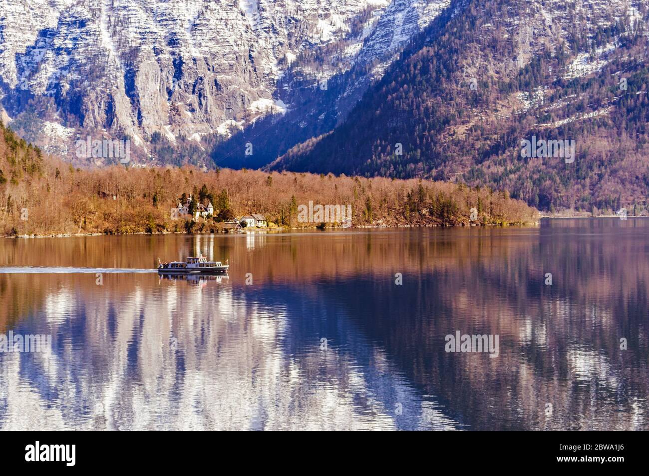 Small tourist boat on the lake in Hallstatt Stock Photo - Alamy