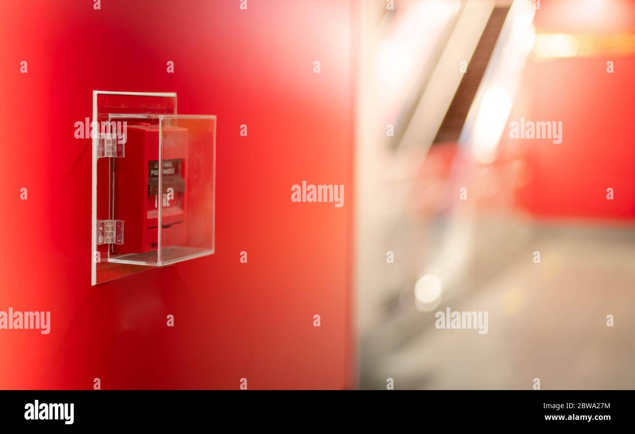 The red fire alarm switch on the red wall at the Bangkok subway Stock ...