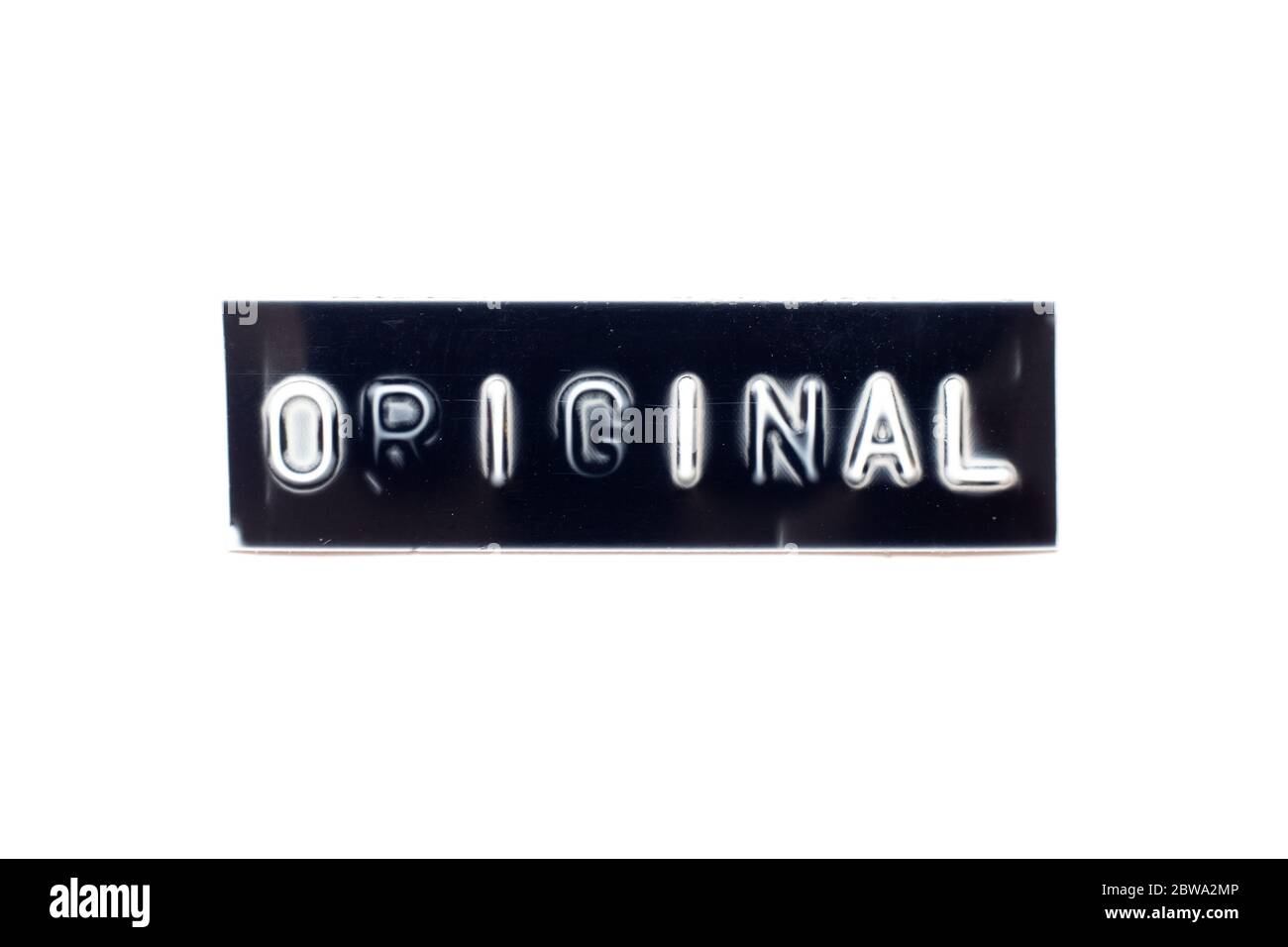 Embossed letter in word original in black banner on white background ...