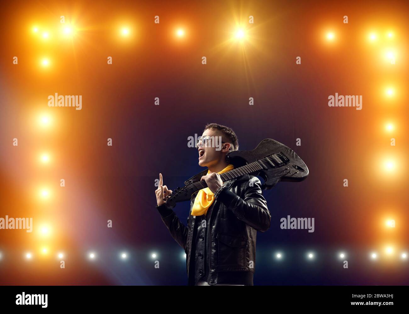 Rock star on stage Stock Photo - Alamy