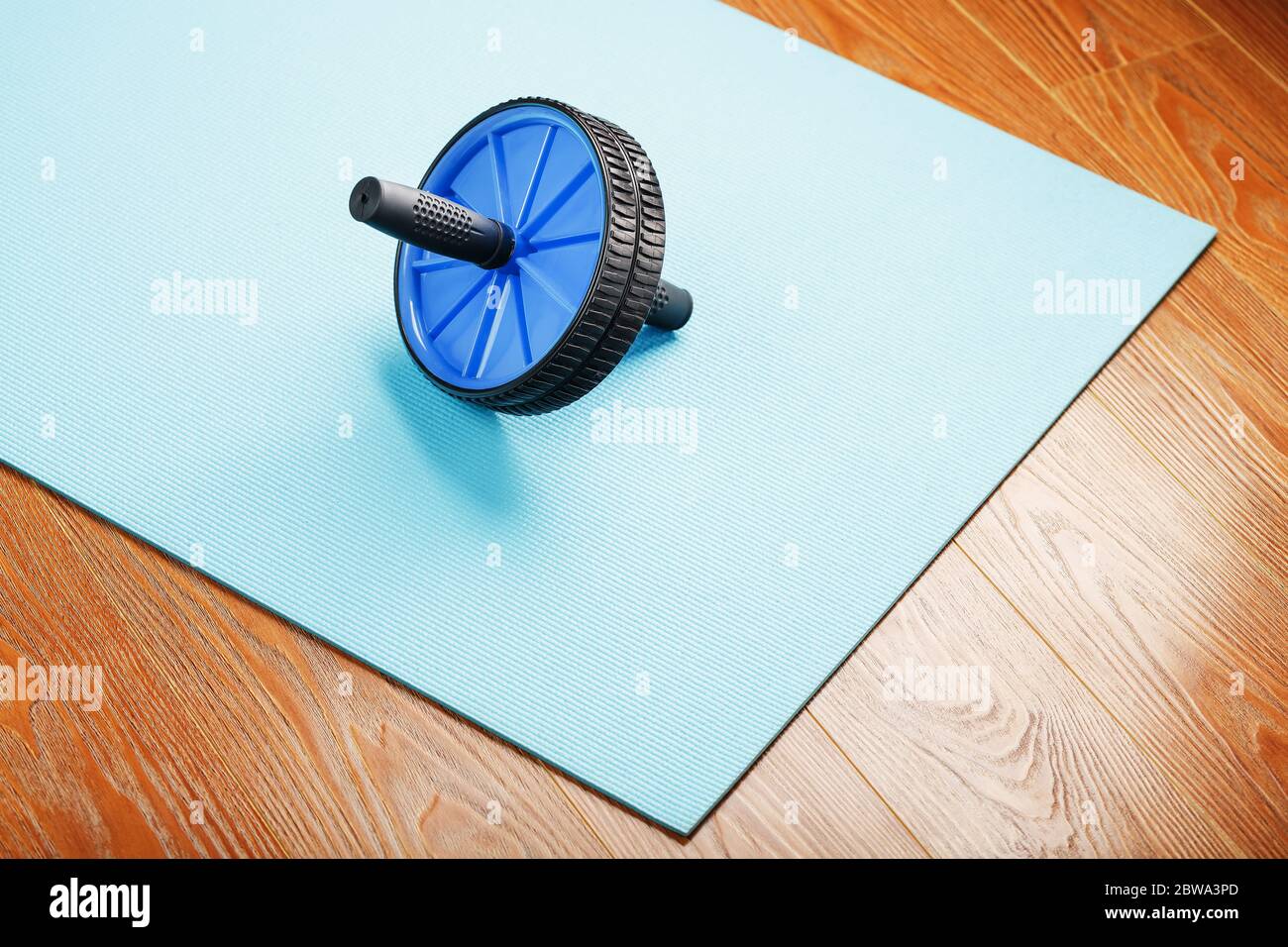 Sports roll for training muscles and abs on the blue Mat Stock Photo ...