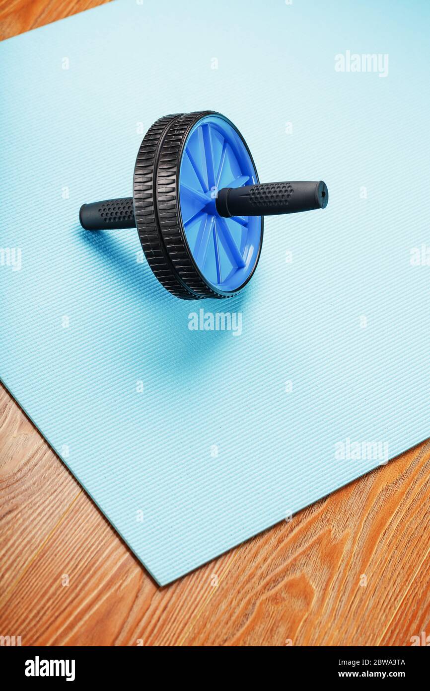 Sports roll for training muscles and abs on the blue Mat Stock Photo ...