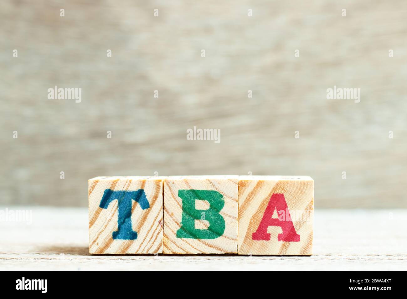 Alphabet letter in word TBA (abbreviation of to be announced) on wood ...