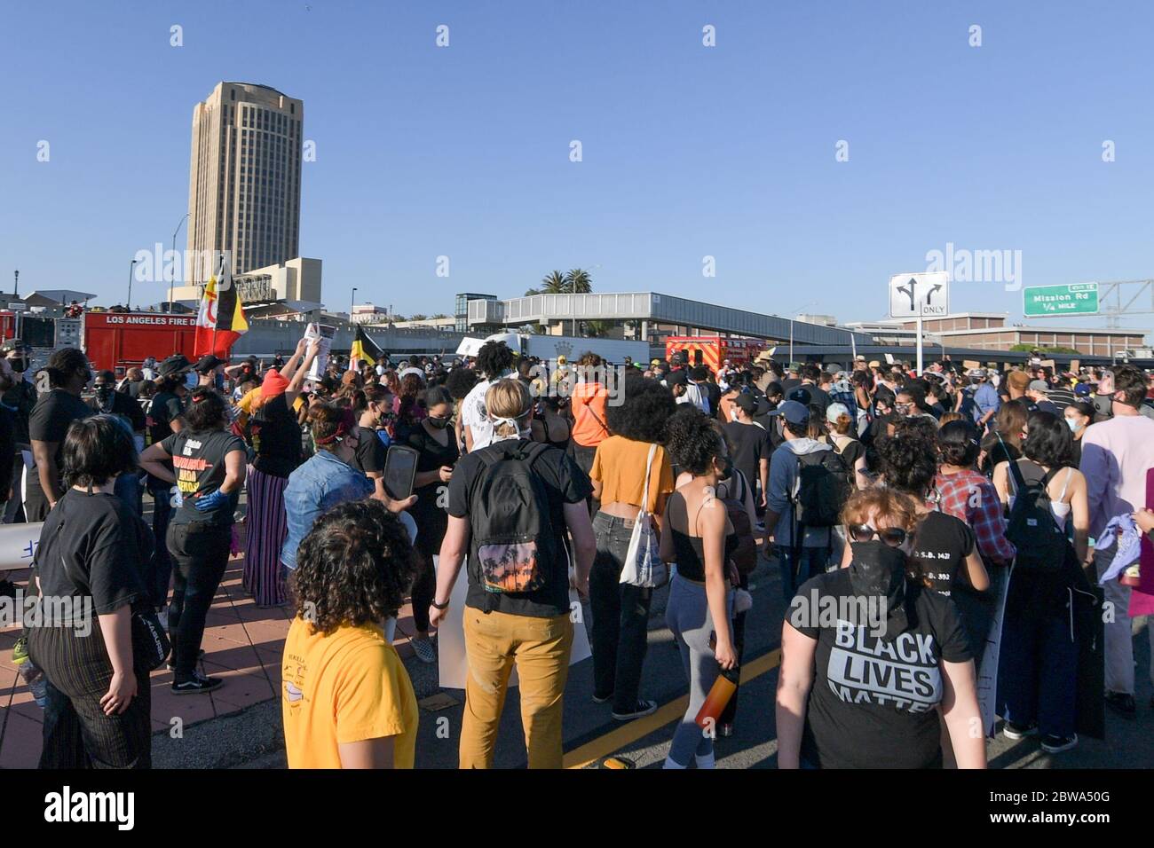 Los Angeles, United States. 27th May, 2020. Demonstrators stand on the ...