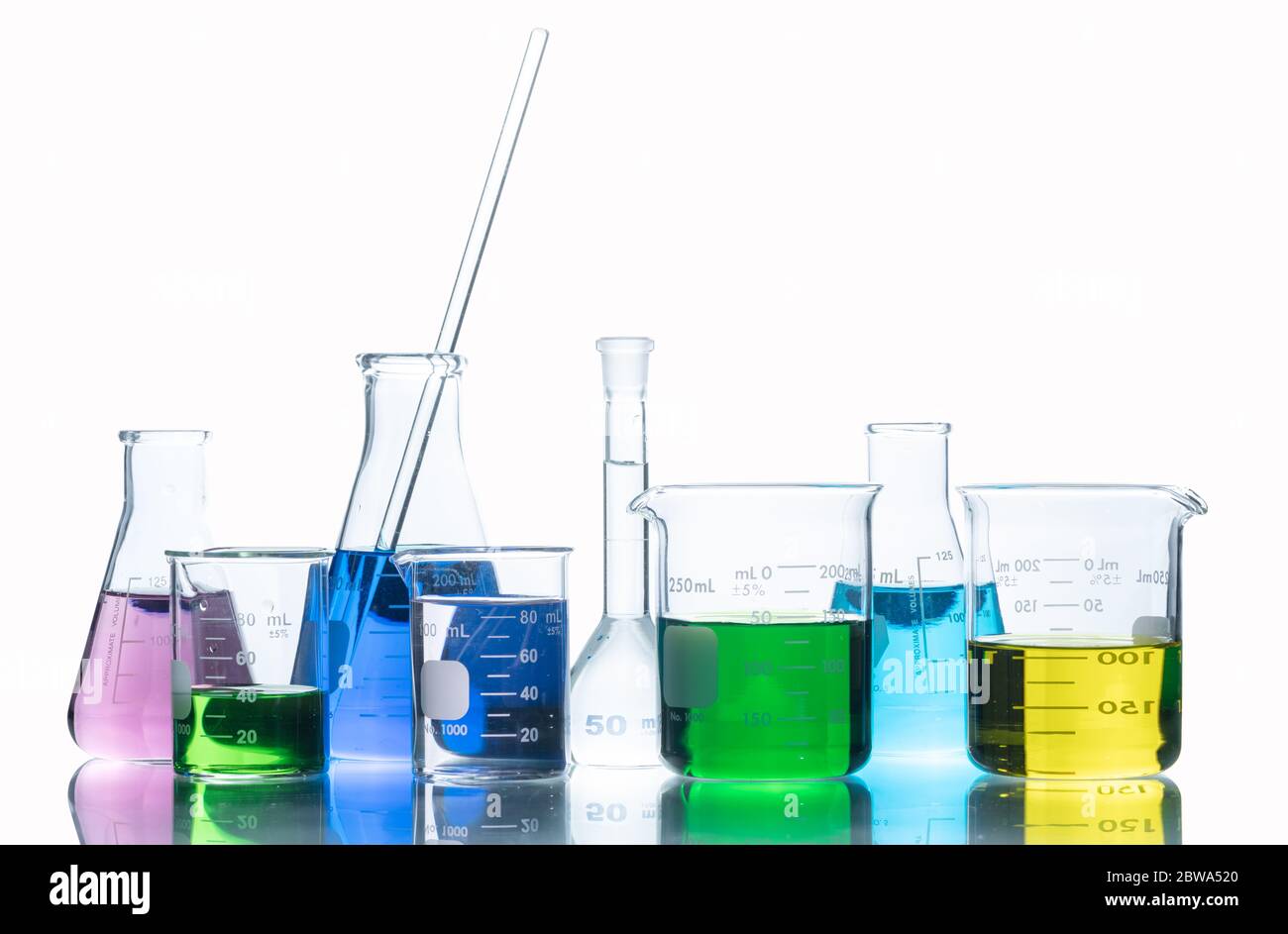 Laboratory glassware with liquids of different colors, Flasks and ...