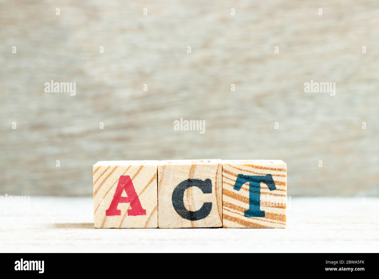 Alphabet letter in word act on wood background Stock Photo - Alamy