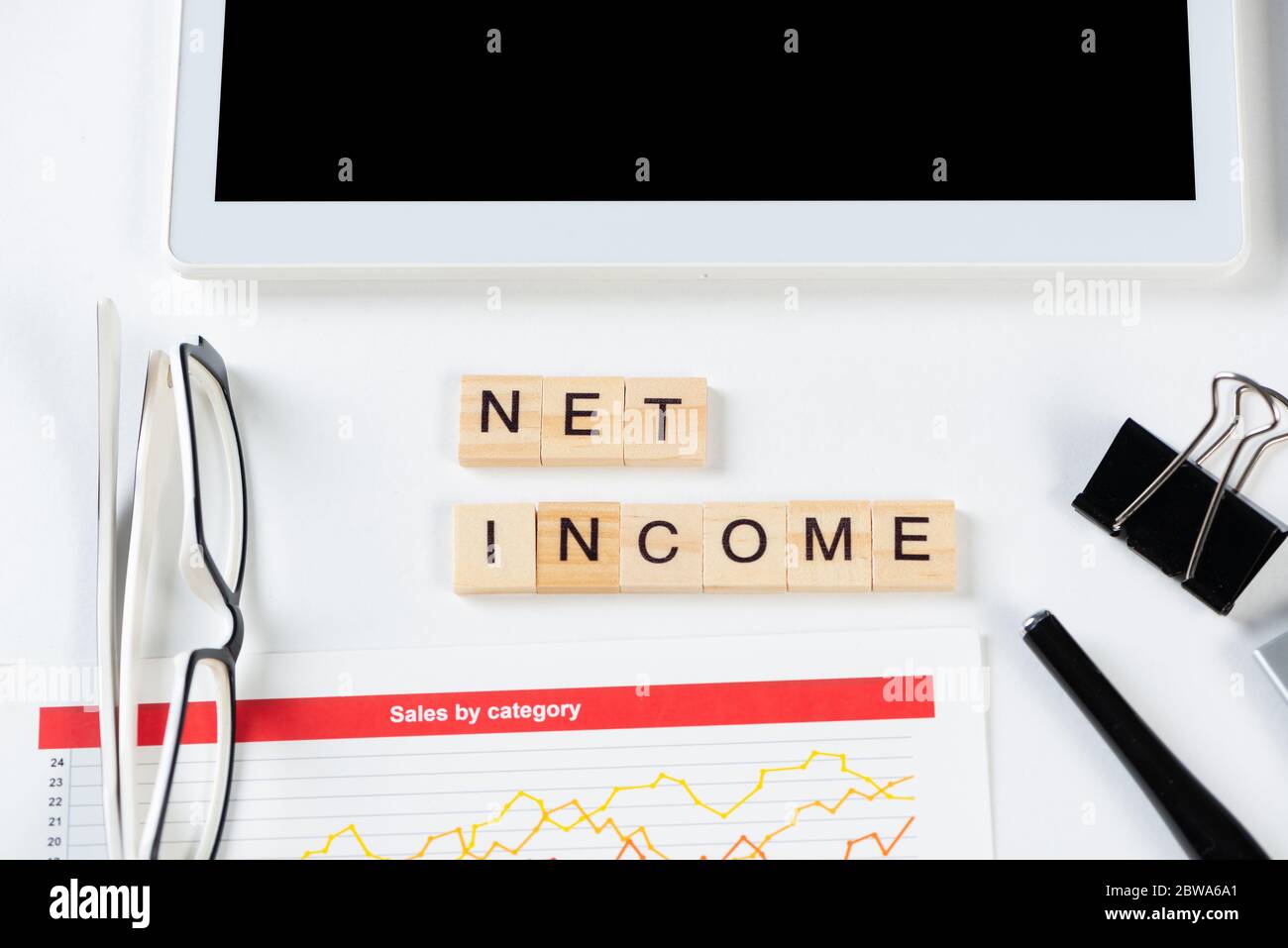 Net income concept with letters Stock Photo - Alamy