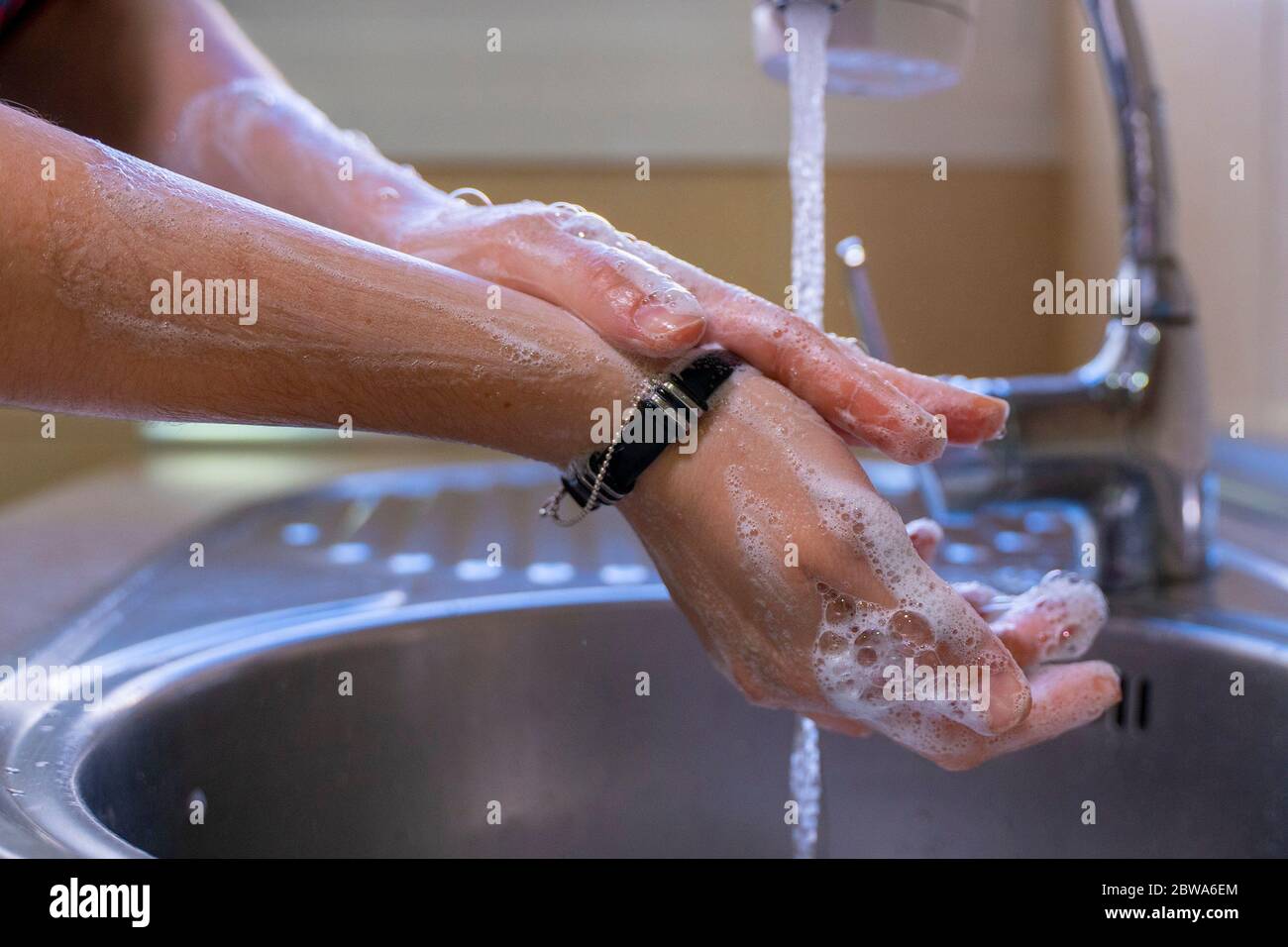 Washing arms and hands properly. Hygiene concept. Rubbing with soap and ...