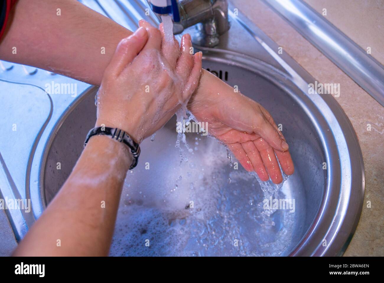 Washing hands and arms properly. Rubbing with soap and water. Hygiene ...