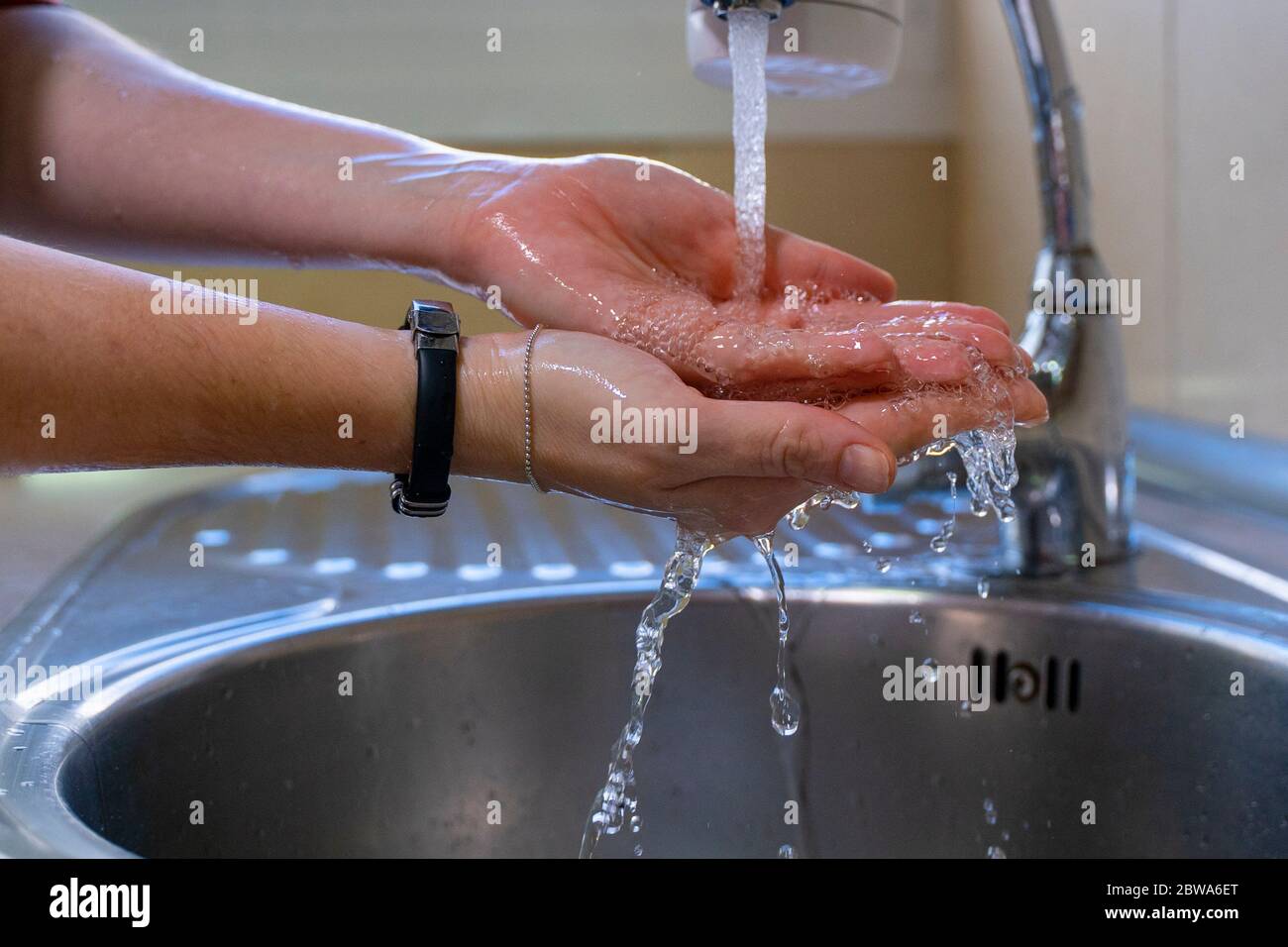Washing hands properly. Hygiene concept. Splashing water Stock Photo ...
