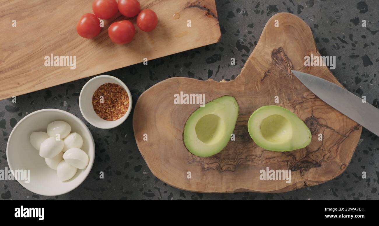 Top view peeled half of ripe avocado on concrete countertop Stock Photo ...