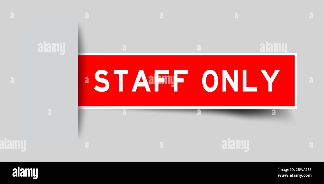 Inserted red color sticker label with word staff only on gray ...
