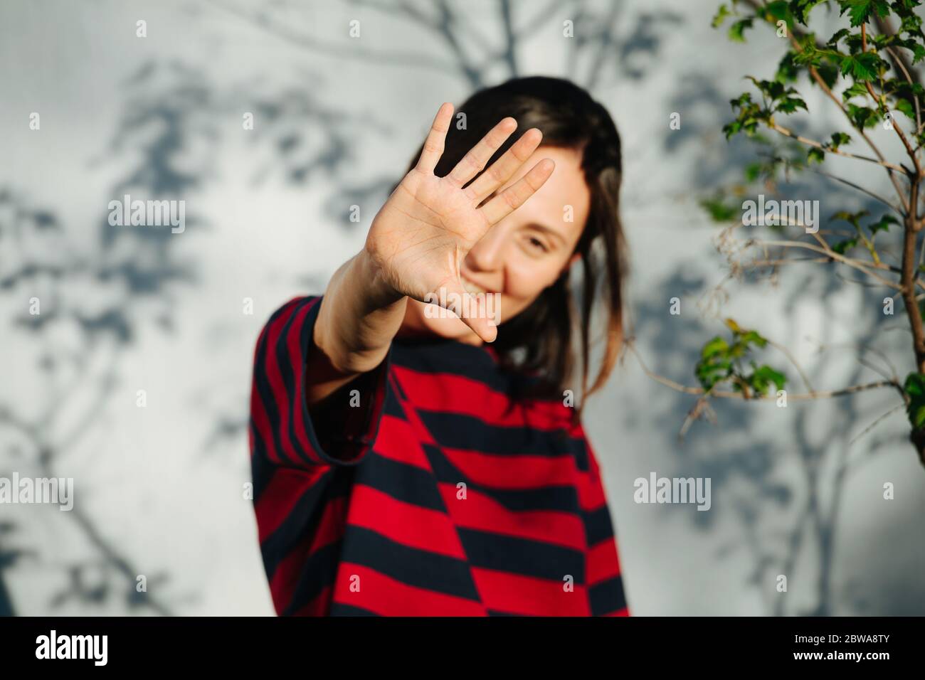 Woman blocking sun face hi-res stock photography and images - Alamy
