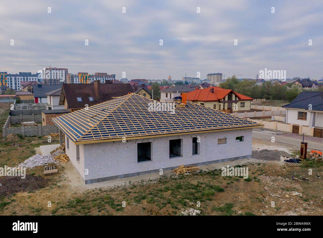 Residential house with wooden roof frame structure under construction ...