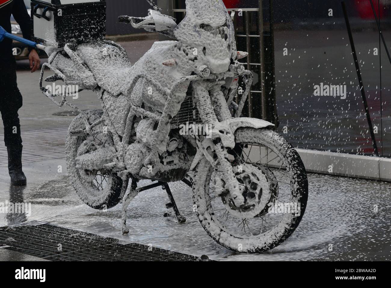 Motorcycle washing with cleaning foam. Pure moto bike. Enduro ...