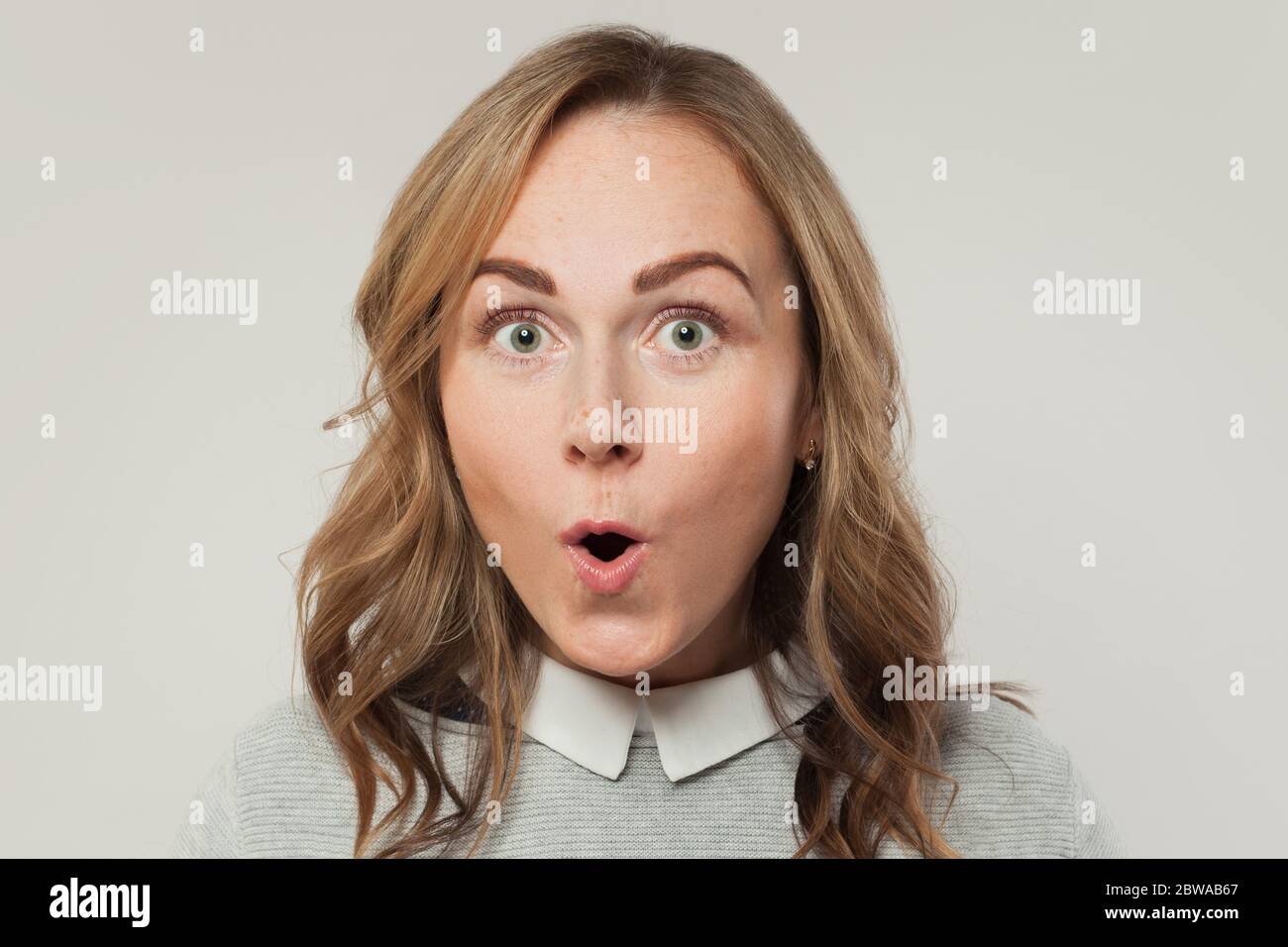 Shocked surprised woman on white, close up portrait Stock Photo - Alamy