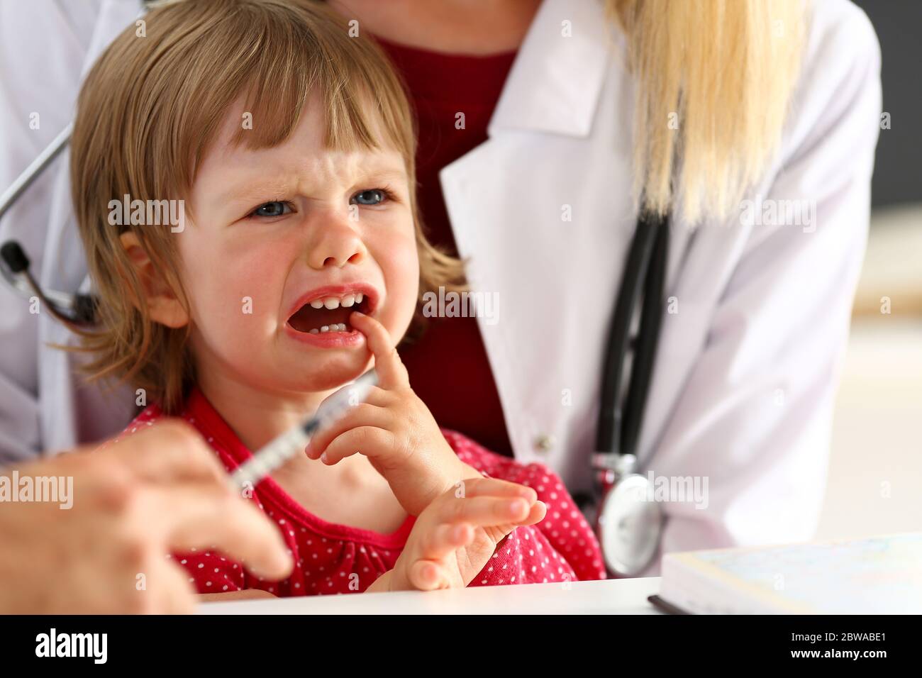 Little scared child at doctor reception make insulin shot Stock Photo ...