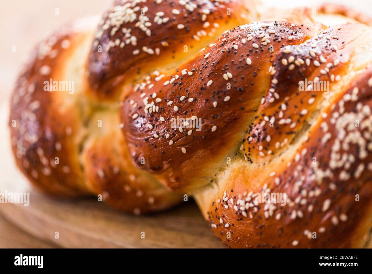 Close up of braided challah bread with sesame and poppy seeds Stock ...