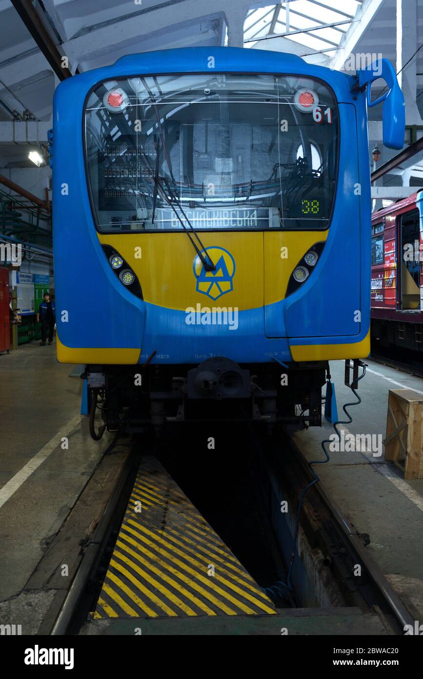 At the maintenance hall: subway trains parked on pits for technical ...
