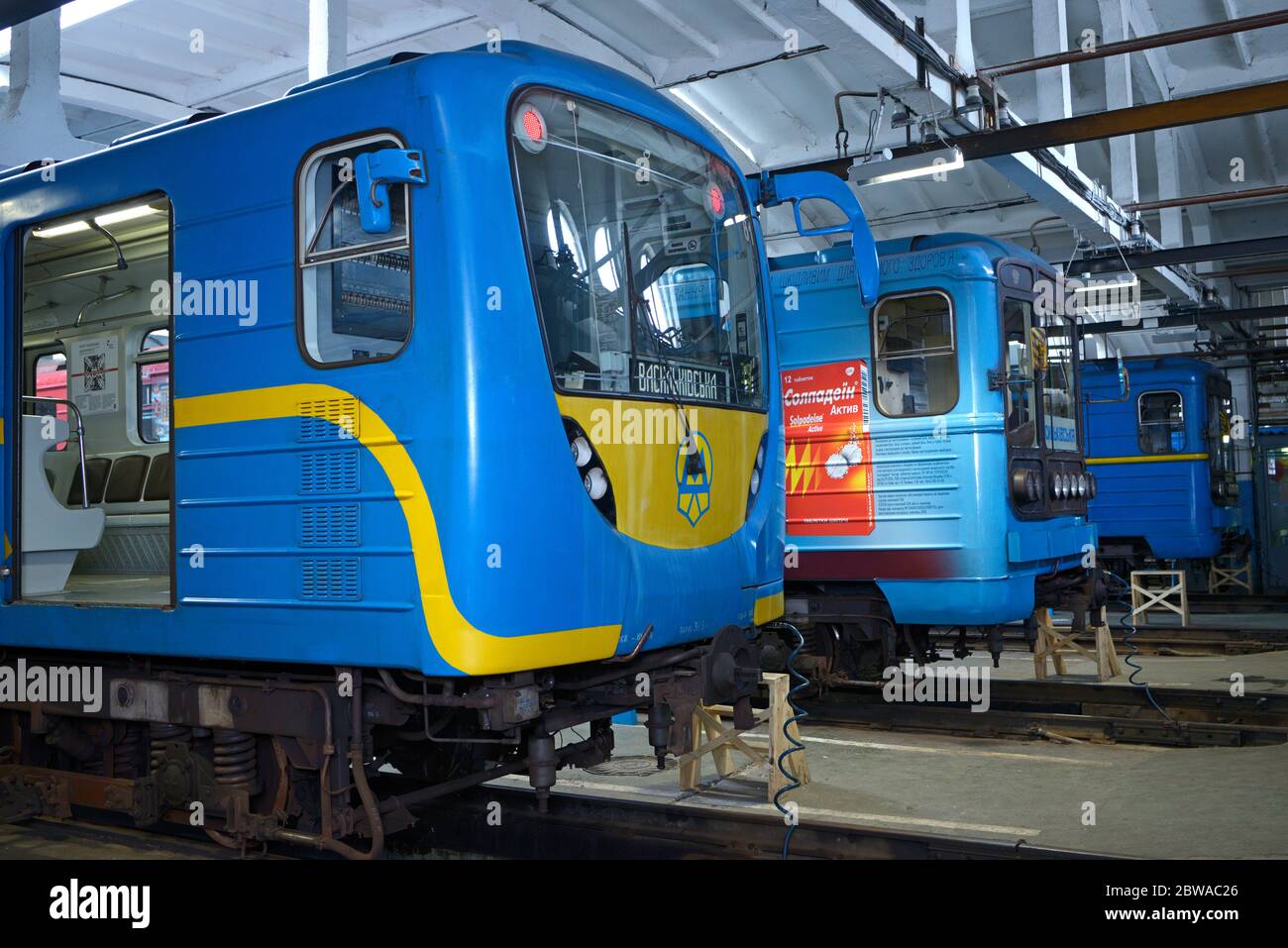 At the maintenance hall: subway trains parked on pits for technical ...