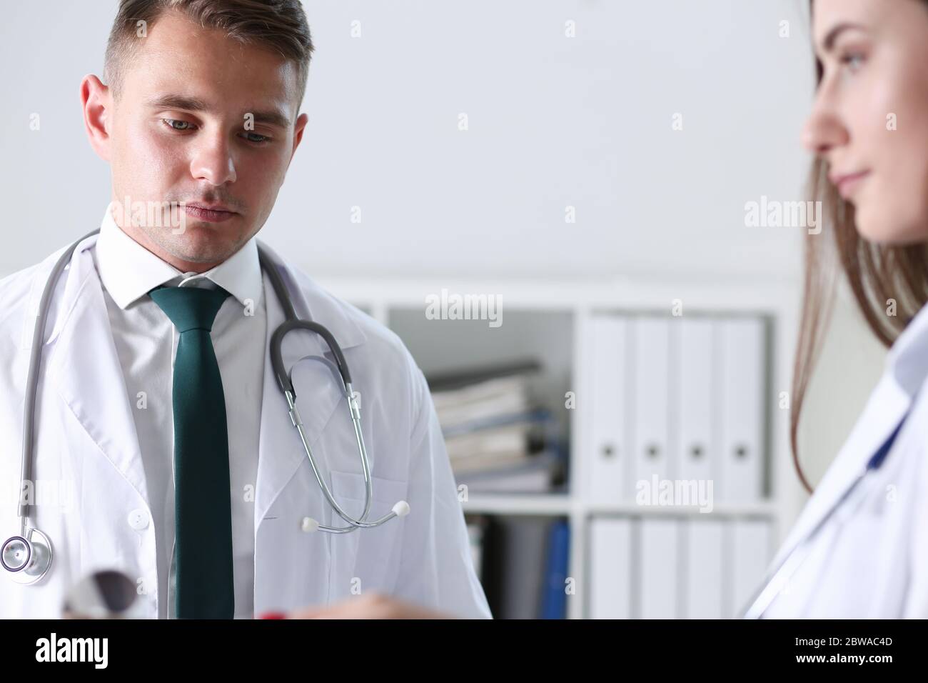 Group of medicine doctors talking during conference Stock Photo - Alamy