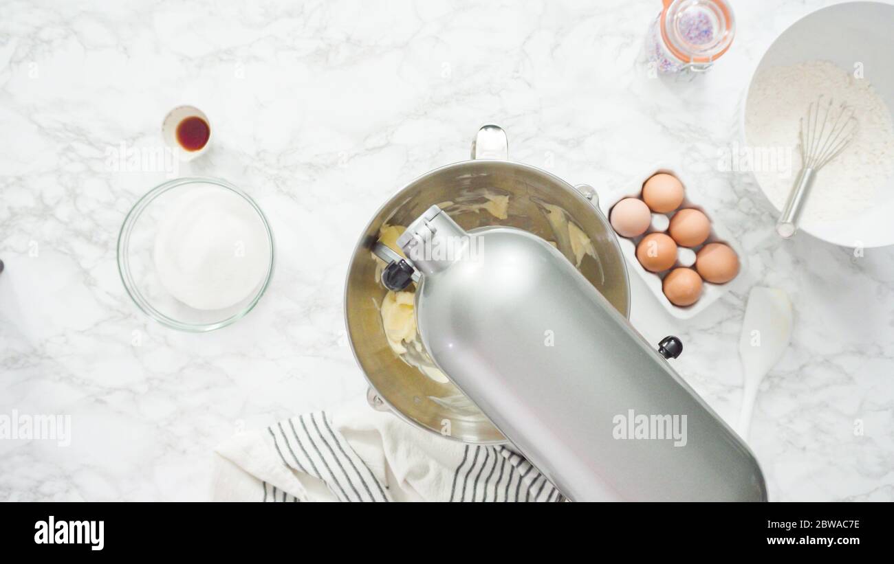 Step by step. Flat lay. Mixing ingredients in standing kitchen mixer to ...