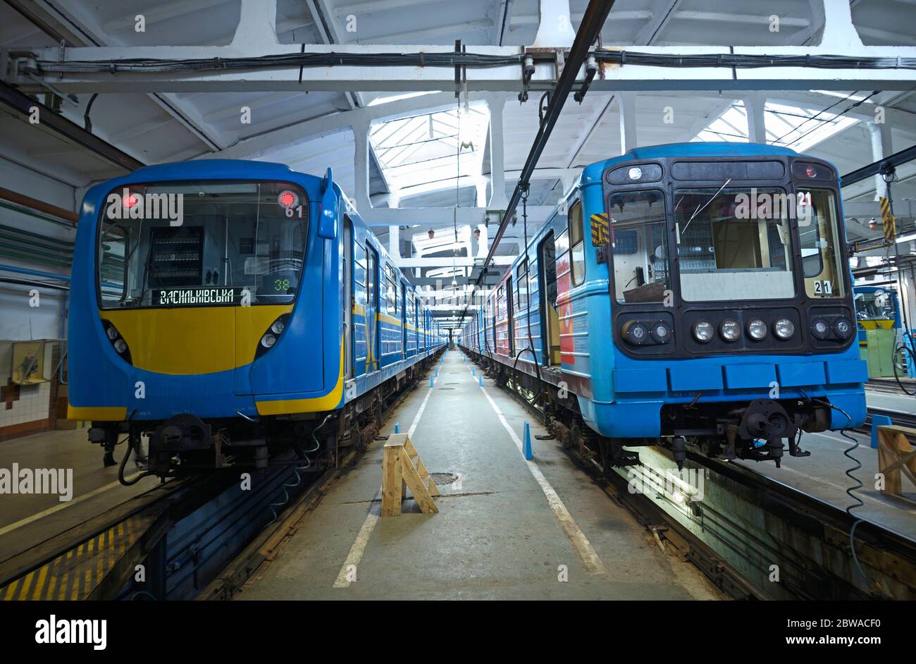 At the maintenance hall: subway trains parked on pits for technical ...