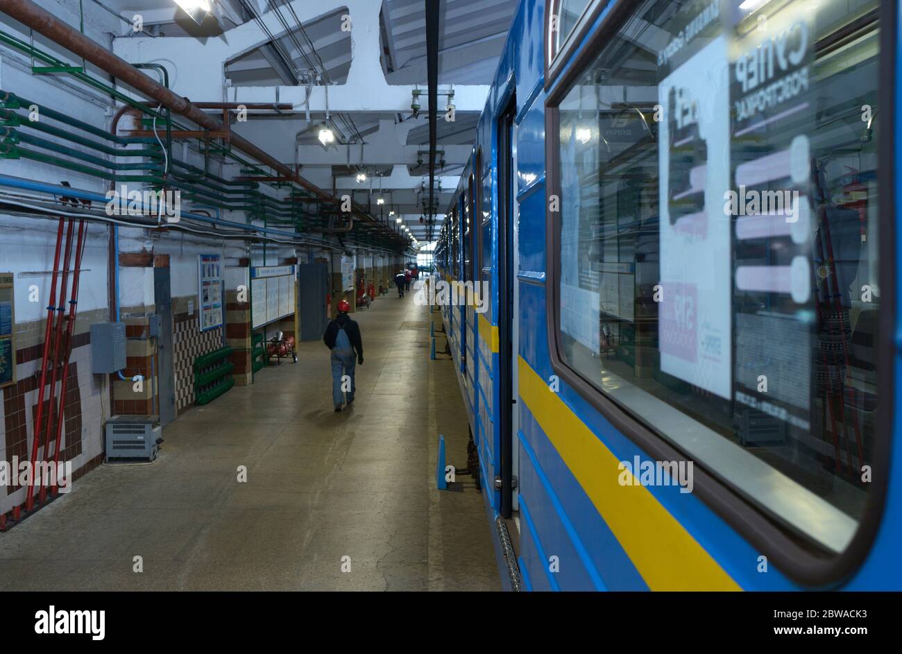 At the maintenance hall: subway trains parked on pits for technical ...