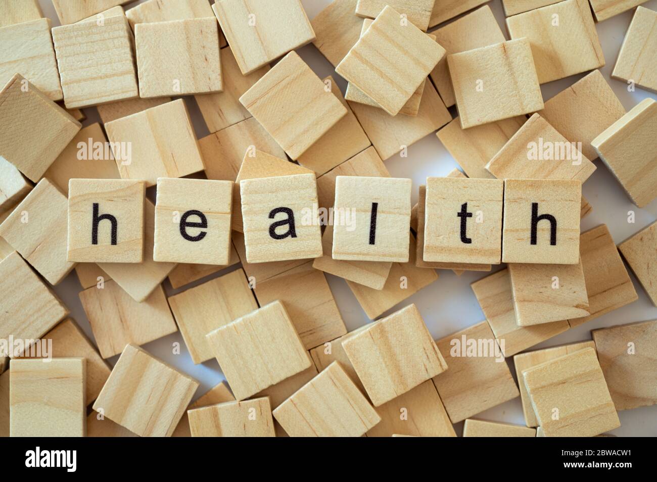 Wooden letter tiles spelling the word HEALTH Stock Photo - Alamy