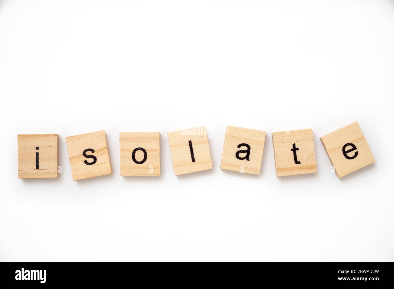 Wooden letter tiles spelling the word ISOLATE Stock Photo - Alamy
