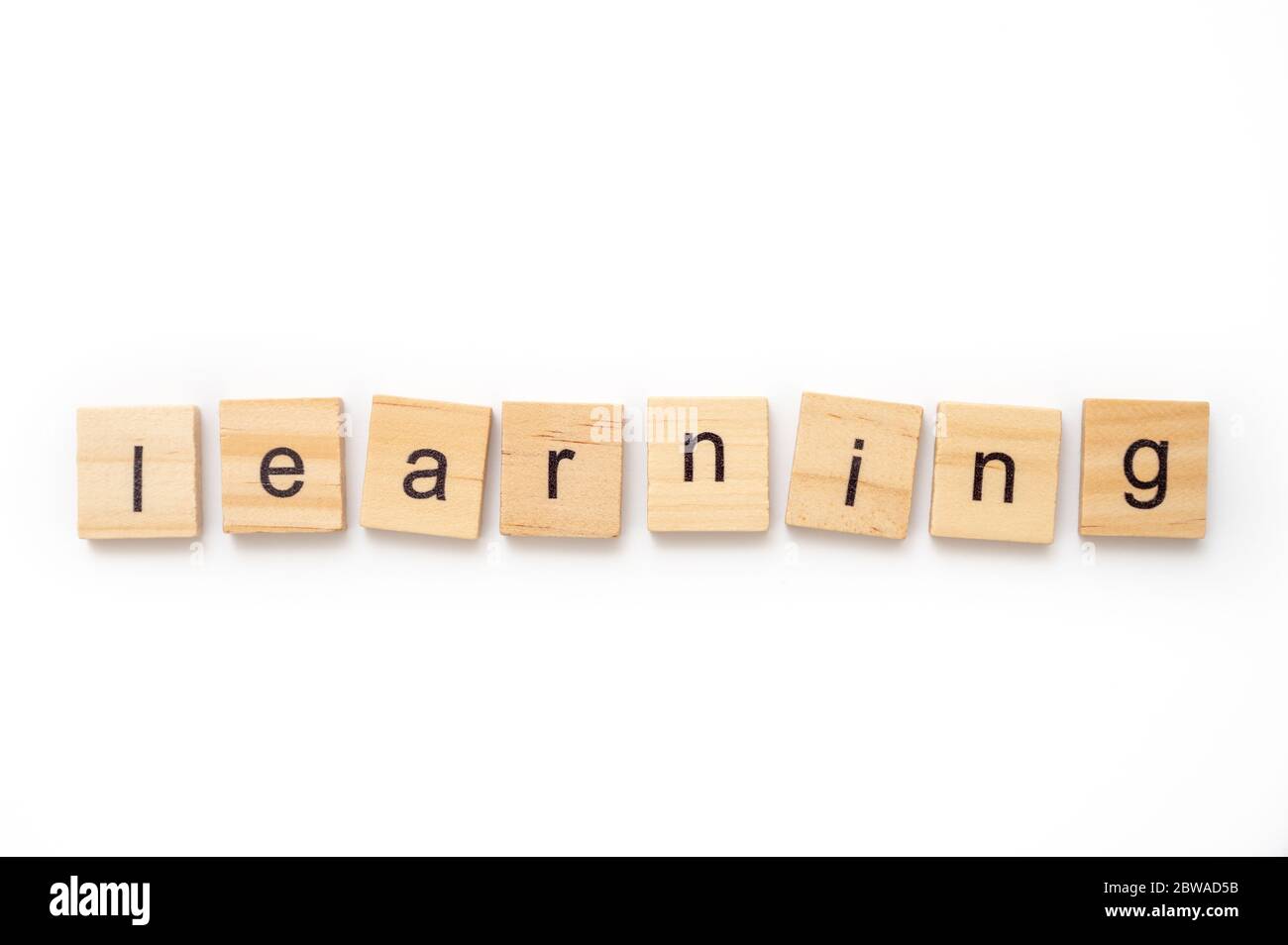 Wooden letter tiles spelling the word LEARNING Stock Photo - Alamy